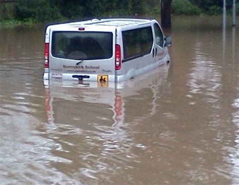 Weather Chaos Pictures Cars Submerged And Roads Crumble Following