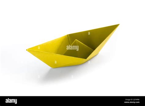 Yellow Paper Boat Origami Isolated On A Blank White Background Stock