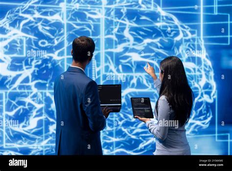 Team Of Admins Using Tablet And Laptop To Do Maintenance On Artificial Intelligence Neural