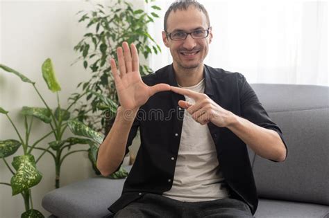 Sign Language Interpreter Man Translating A Meeting To ASL American