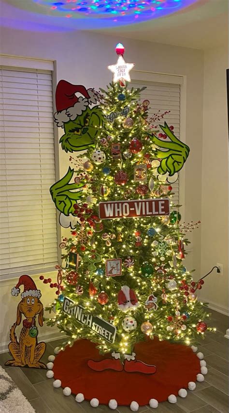 A Christmas Tree Decorated With The Grins Whoville Sign And Other