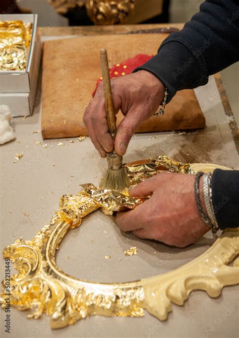 Application Of Gold Leaf To A Frame Gilding Process Technique Stock