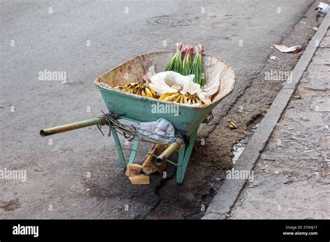 A Wheelbarrow With Fruit And Spices For Sale The Object Is Stationary