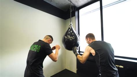 Man At Boxing Gym Jabs At Punching Bag 11743387 Stock Video At Vecteezy