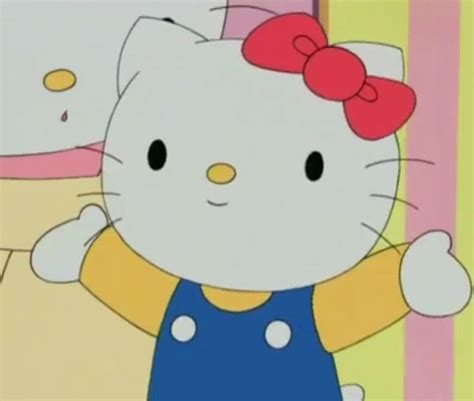A Hello Kitty Cartoon With An Orange Bow On Her Head And Blue Overalls