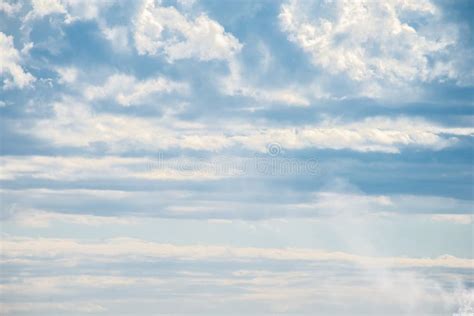 A Cluster Of Cumulus Thunderclouds In A Bright Blue Sky During The Daytime Stock Image Image