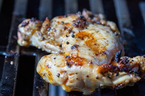 Marinated Pork Steak And Chicken Steak On The Grill Grate With Flames