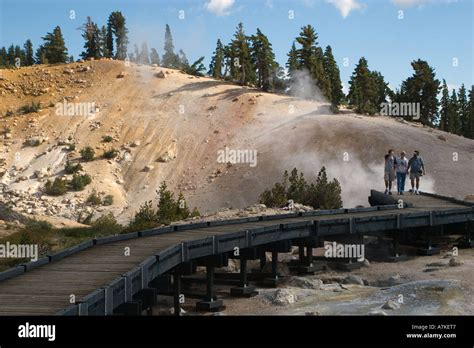 Steam Engulfs Visitors On A Wooden Pathway At The Hot Sulphur Springs