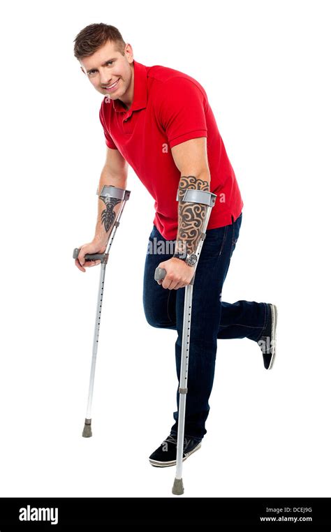 Young Man Recovering From Severe Accident Walking With Help Of