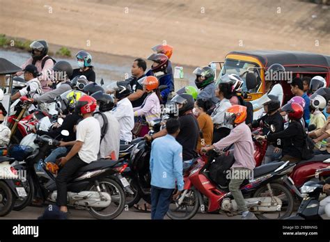 People Crossing Tonle Sap River On A Ferry At Kampong Chamlong Phnom