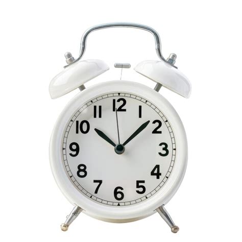 White Alarm Clock With Black Numbers And Hands Set To 12 Oclock