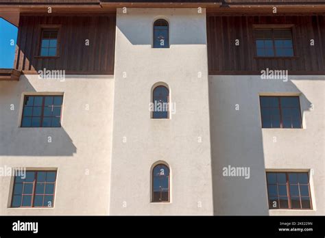 A Minimalist Archtecture Composition With Arched And Square Windows