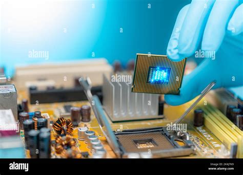 Electronic Engineer Hand Putting Computer Chip On Socket Chipset On