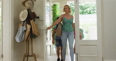 Caucasian Mother Son And Daughter Returning Home Happy Running And