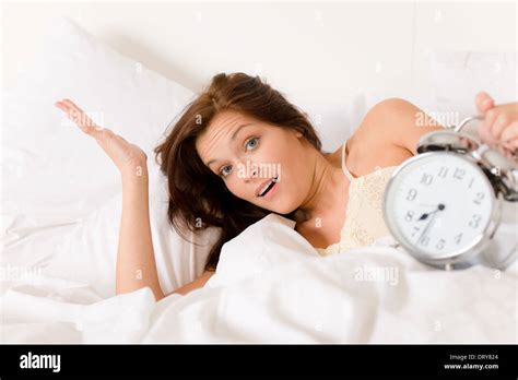 Bedroom Woman With Alarm Clock Wake Up Stock Photo Alamy