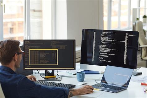 Premium Photo Back View Portrait Of Male Programmer Writing Code At Computer Screen In It