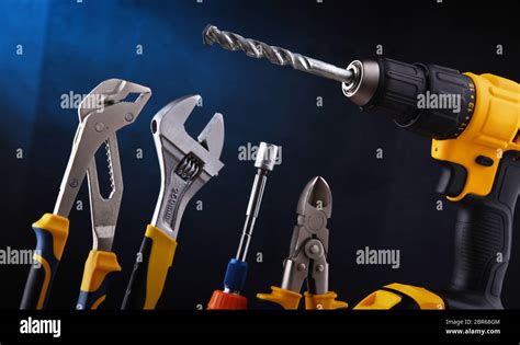 Composition With Different Kinds Of Hardware Tools Including Cordless Drill Monkey Spanner And