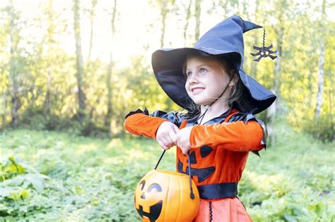 Premium Photo Halloween Cute Girl Going To Collect Candy Trick Or