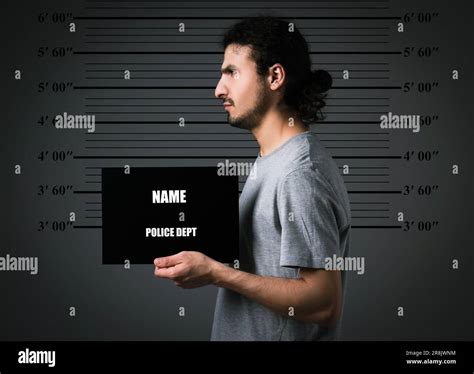 Criminal Mugshot Arrested Man With Blank Card Against Height Chart