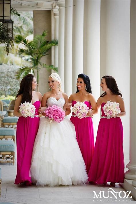 Bride With The Brides Maid Wearing A Hot Pink Colored Gown 2050057