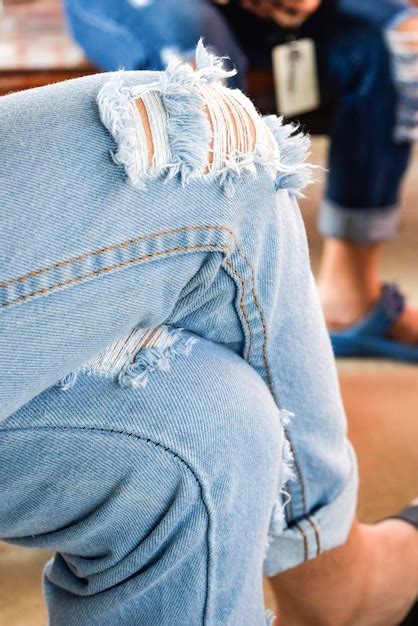 Premium Photo Midsection Of Person Wearing Torn Jeans