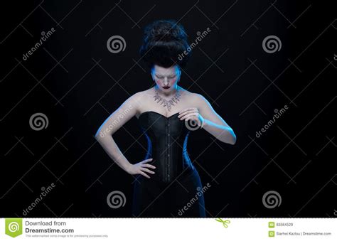 Portrait Of The Actress Brunette Woman With High Hair In A Diamond