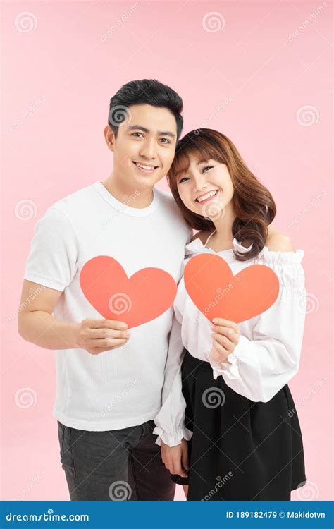 Couple Holding An Heart Symbol Of Love On Valentine`s Day Stock Image