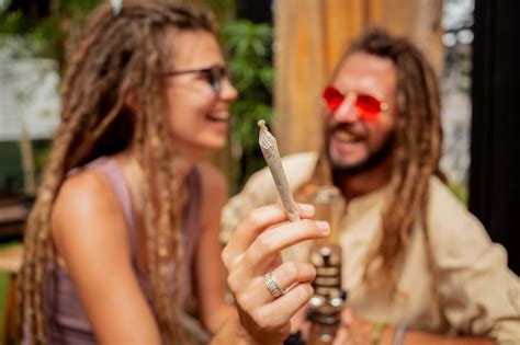 Premium Photo Hippie Style Couple Smoking Cigarettes With Medical