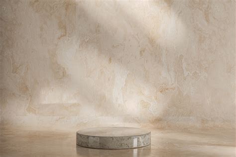 제품 배치 연단 둥근 대리석 연단은 베이지색 배경의 중앙에 있습니다 연단 표면은 자연스러운 질감을 자랑하며 사치품 전시에 이상적인 환경을 제공합니다 보여주기에 대한 스톡