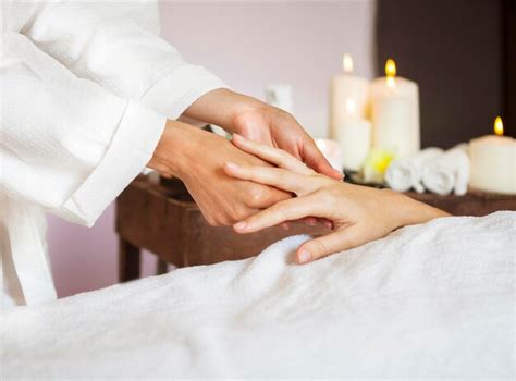 Premium Photo Midsection Of Therapist Massaging Woman At Spa
