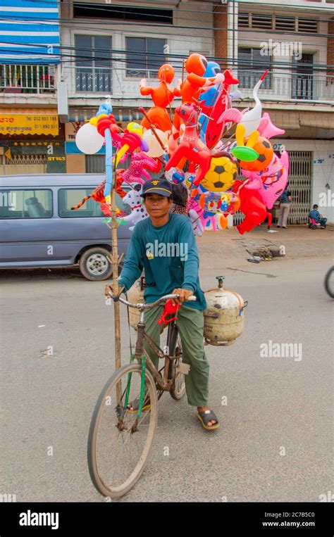 A Street Vendor Is Selling Balloons In Phnom Penh The Capital City Of