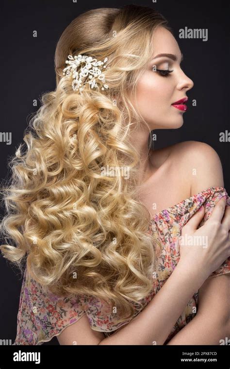Portrait Of A Beautiful Blond Girl In Image Of The Bride With Purple