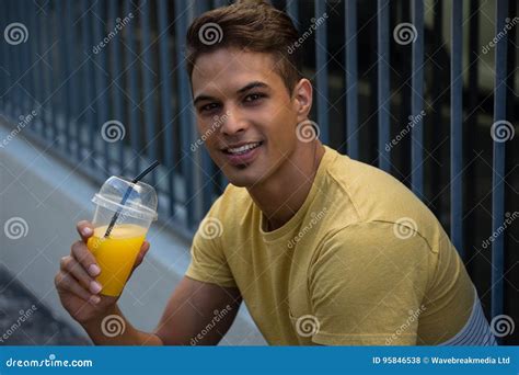 Portrait Of Smiling Man Holding Juice Stock Photo Image Of Leisure Adult