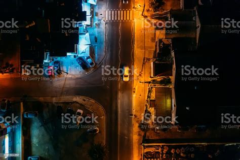 Aerial Top View Of Night Illuminated Road With Car In Mediterranean