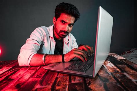 Premium Photo Computer Hacker Working Red Room