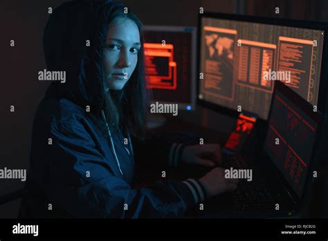Girl In The Hood Looking In The Camera Hacker Attacks And Online Fraud
