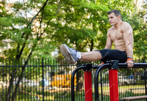 Premium Photo Athletic Male Athlete With A Naked Torso Trains The