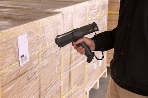 Premium Photo Warehouse Worker Holding Barcode Scanner With Scanning