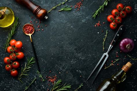 Premium Photo Black Stone Cooking Background Spices And Vegetables Top View Free Space For