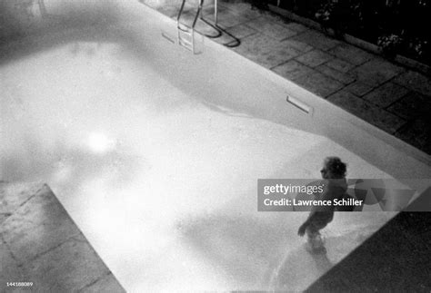 Apply American Actress Marilyn Monroe Steps Into A Pool For A Scene