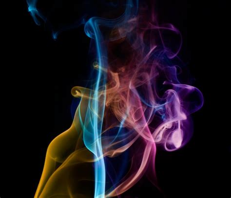 Premium Photo Close Up Of Colorful Abstract Smoke Pattern Against Black Background