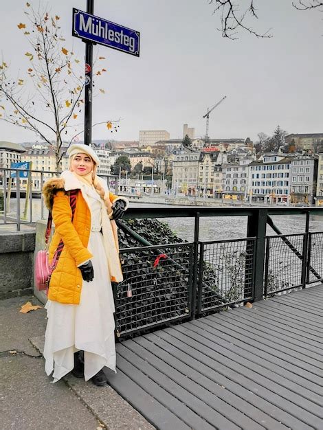 Premium Photo An Asian Female Model On Railing Against Buildings Sidewalk With A Stylish White