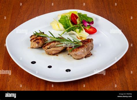 Delicious Beef Medallions With Salad Stock Photo Alamy