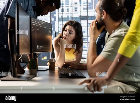 It Staff Members Gathered Together To Conduct Code Review To Fix Bugs