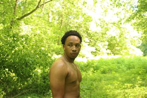 Premium Photo Portrait Of Shirtless Man Standing Against Trees