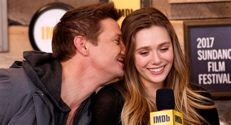 Jeremy Renner Gives Elizabeth Olsen A Friendly Kiss During Sundance
