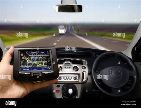 GPS Vehicle Navigation System In The Hand Of A Man Stock Photo Alamy
