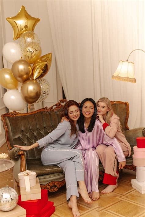 Three Positive Young Interracial Girls In Sleepwear Are Having Pajama