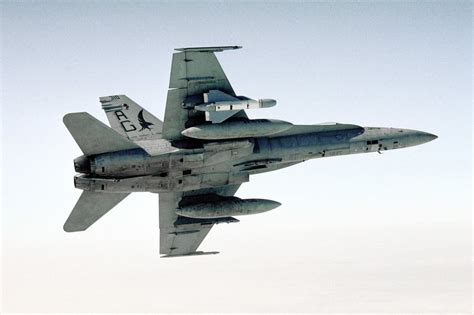 An Air To Air Underside View Of An F A 18c Hornet From Strike Fighter Squadron 136 Vfa 136