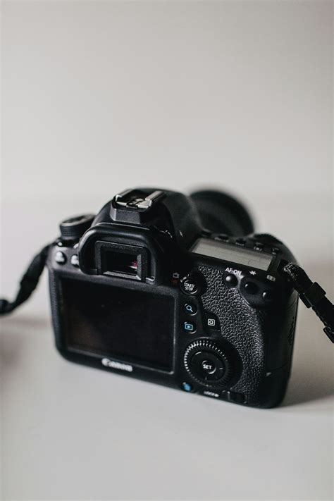흰색 표면에 검은색 Canon Dslr 카메라 사진 Unsplash의 무료 사진기 이미지